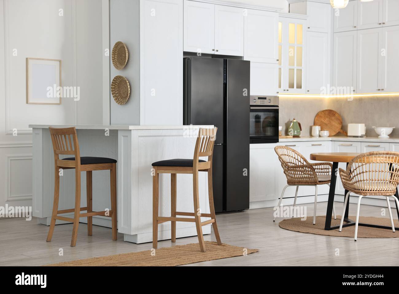 Stylish kitchen with bar stools. Interior design Stock Photo - Alamy