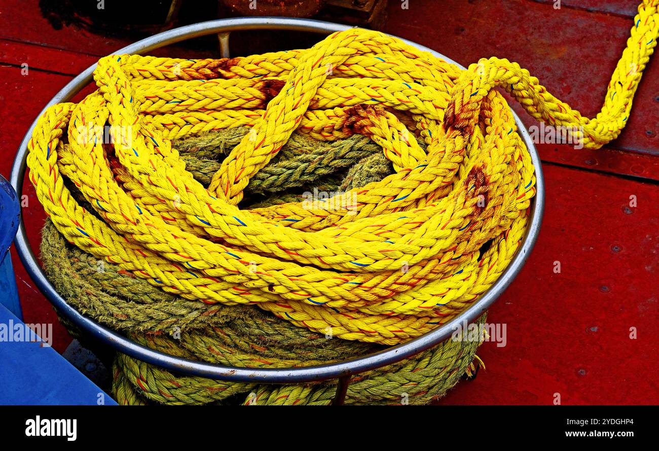 Creel of thick yellow nylon polyester rope hawser Stock Photo - Alamy