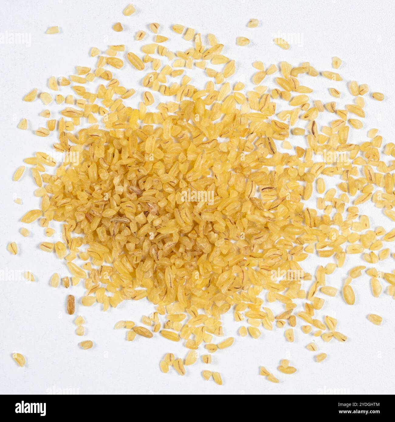 Macro scattered bulgur cracked wheat on a white background Stock Photo ...