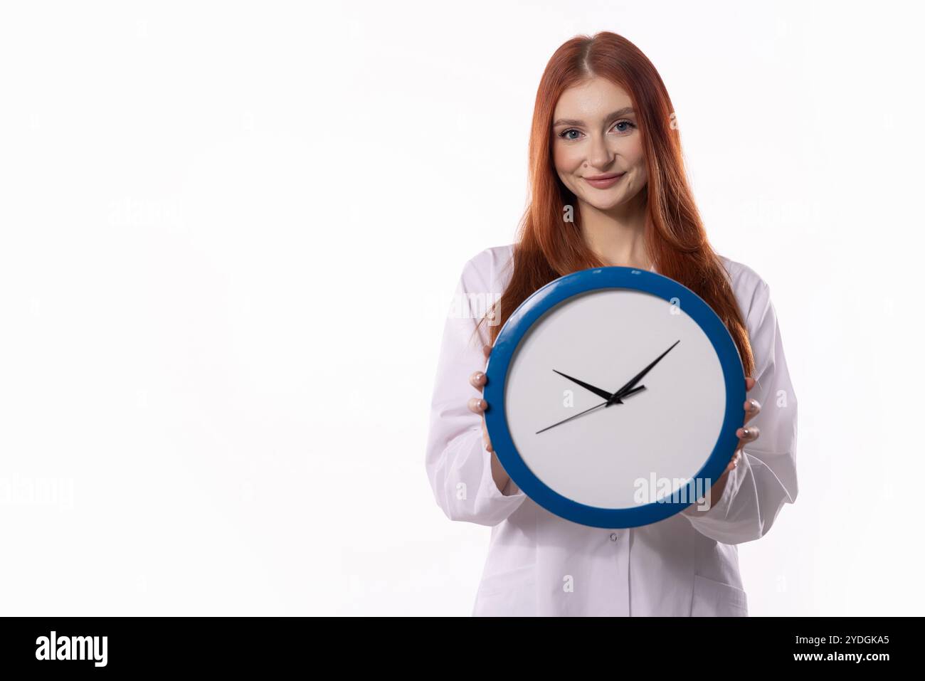 A Smiling Woman Holding a Clock Against a Bright, Clean White ...