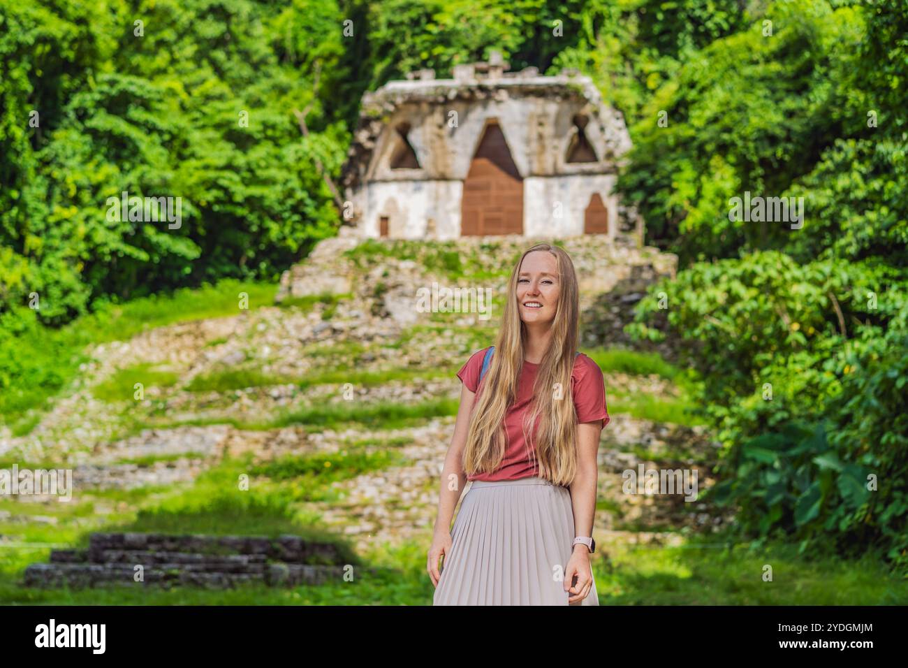 Female tourist exploring the ancient pyramids of Palenque, Mexico ...