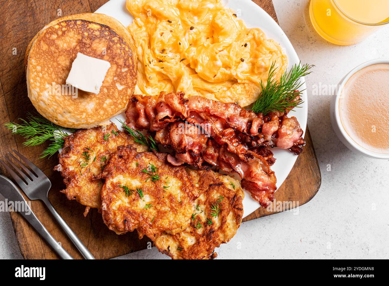 Full American Breakfast with scrambled eggs, bacon, hash browns and ...