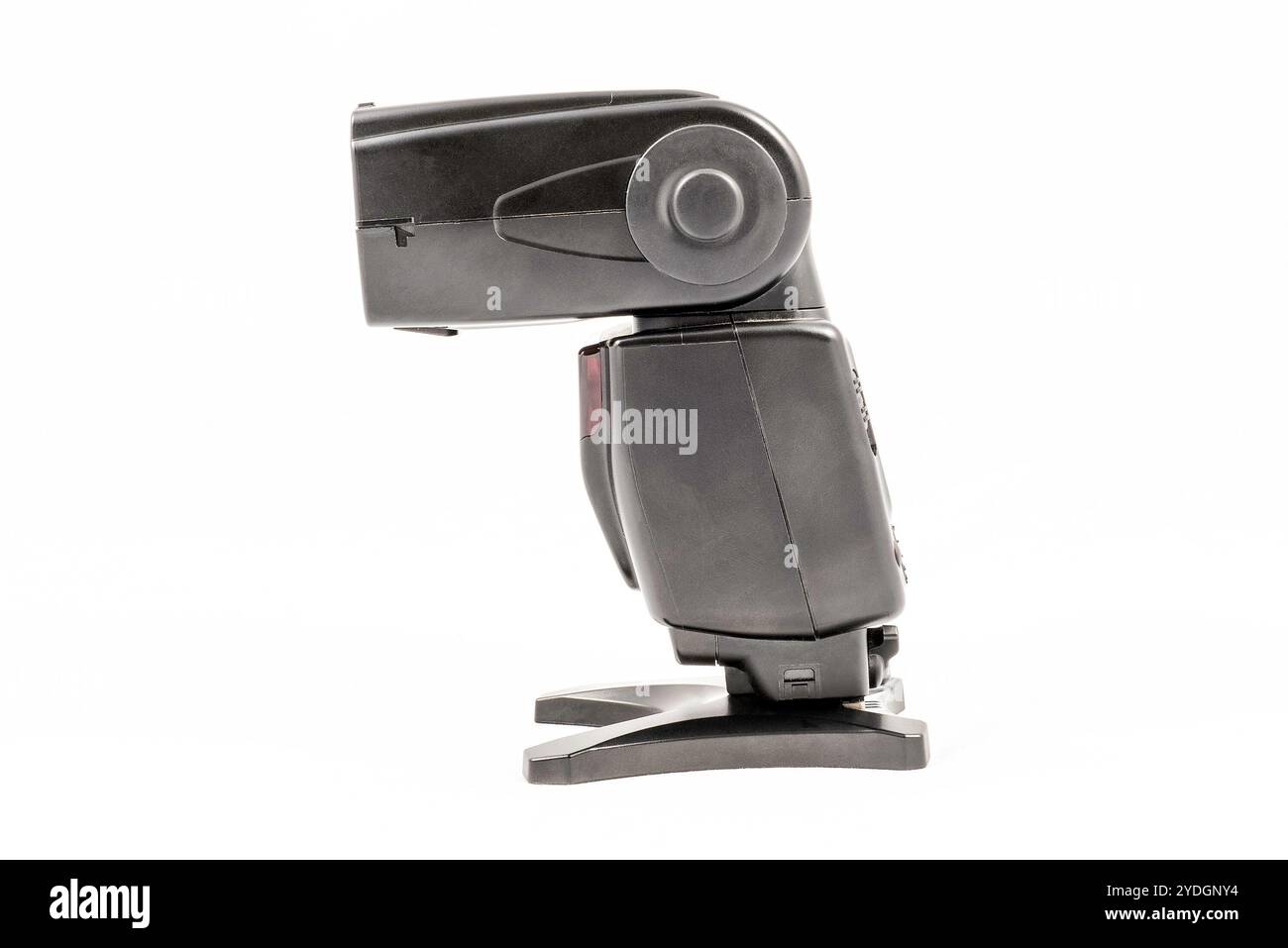 Side view of a black unbranded external flash unit for DSLR camera ...