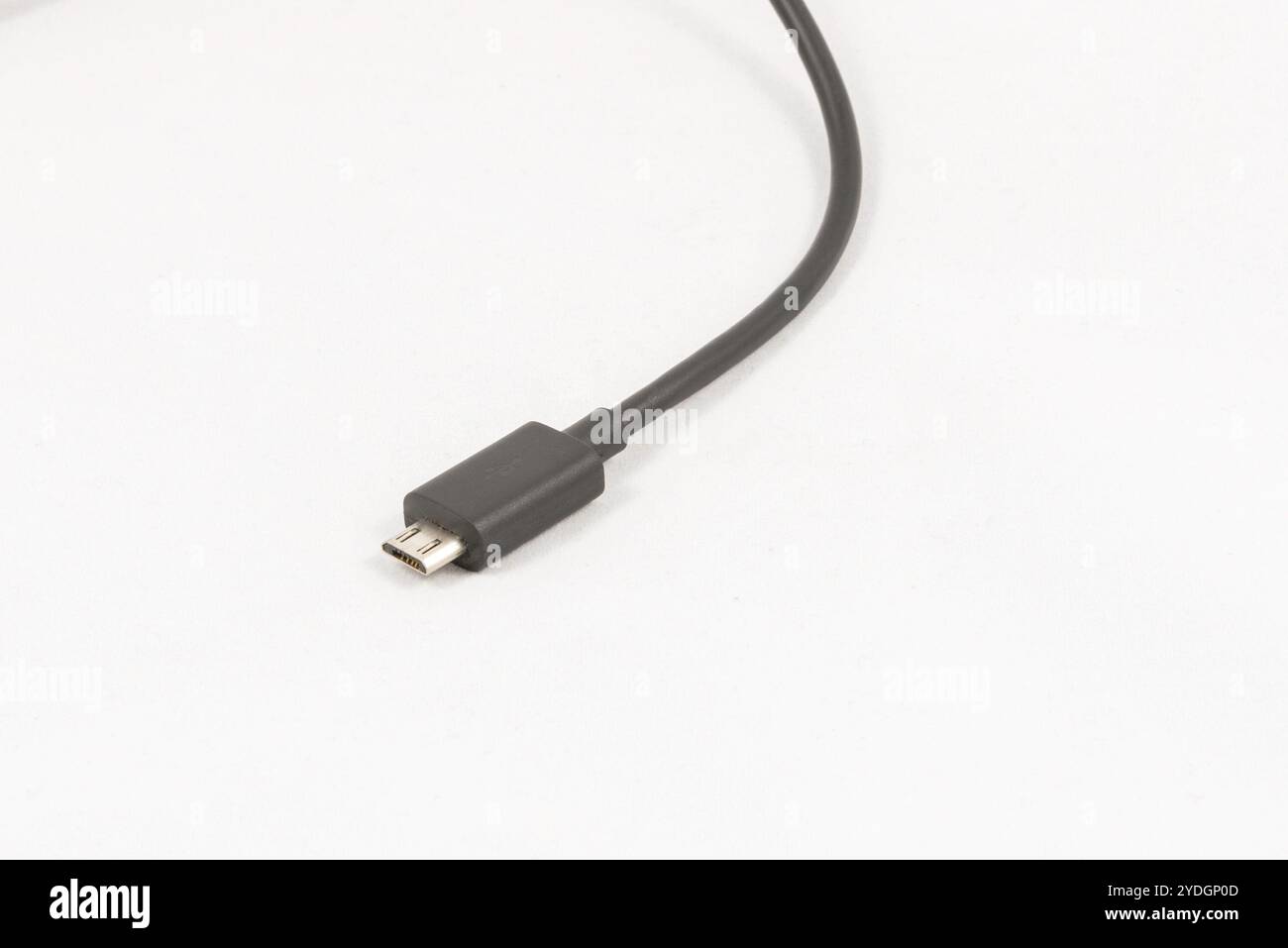 Black micro USB cable isolated on white background Stock Photo - Alamy