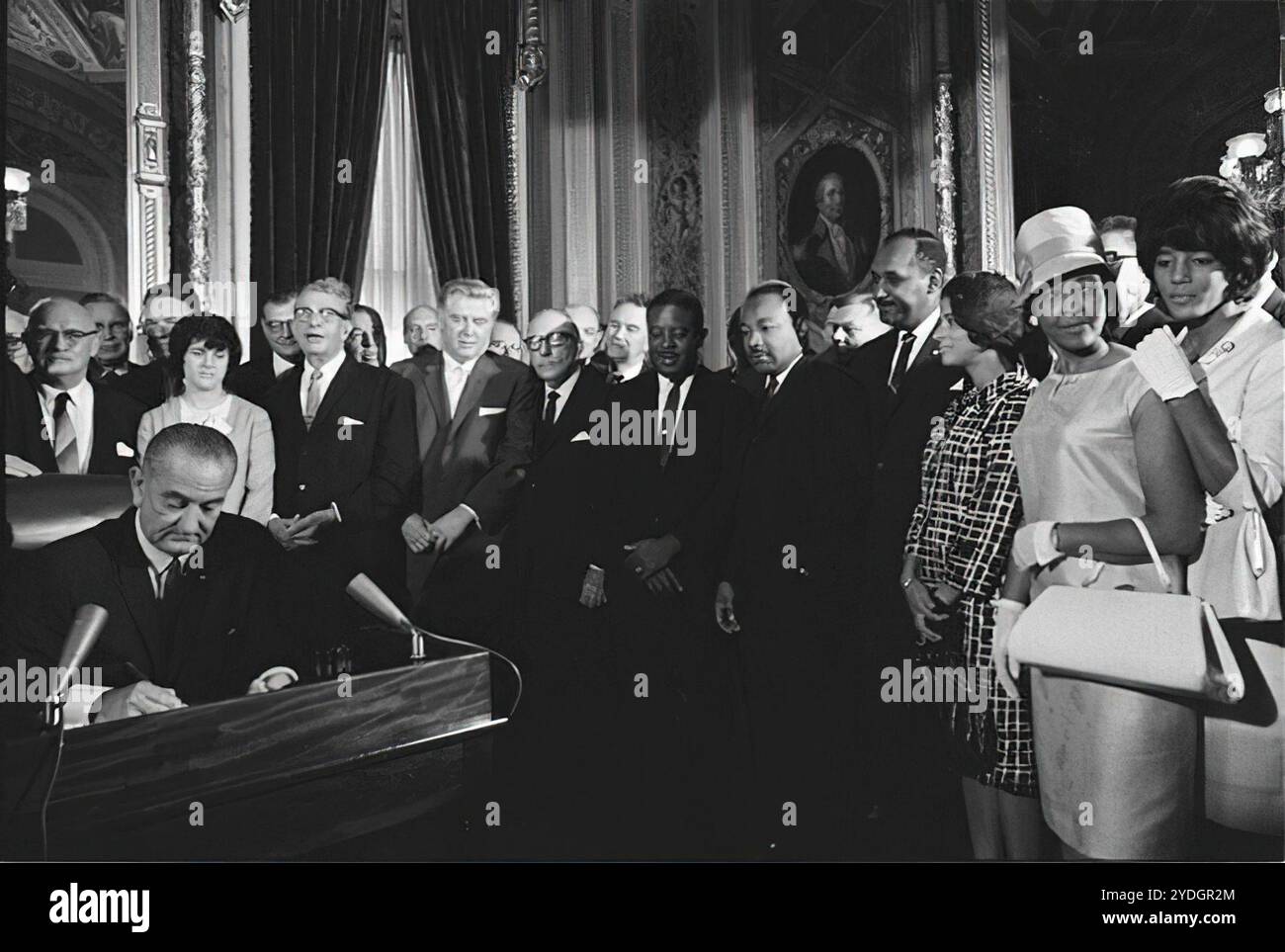 President Lyndon B. Johnson signs the Voting Rights Act of 1965 while ...