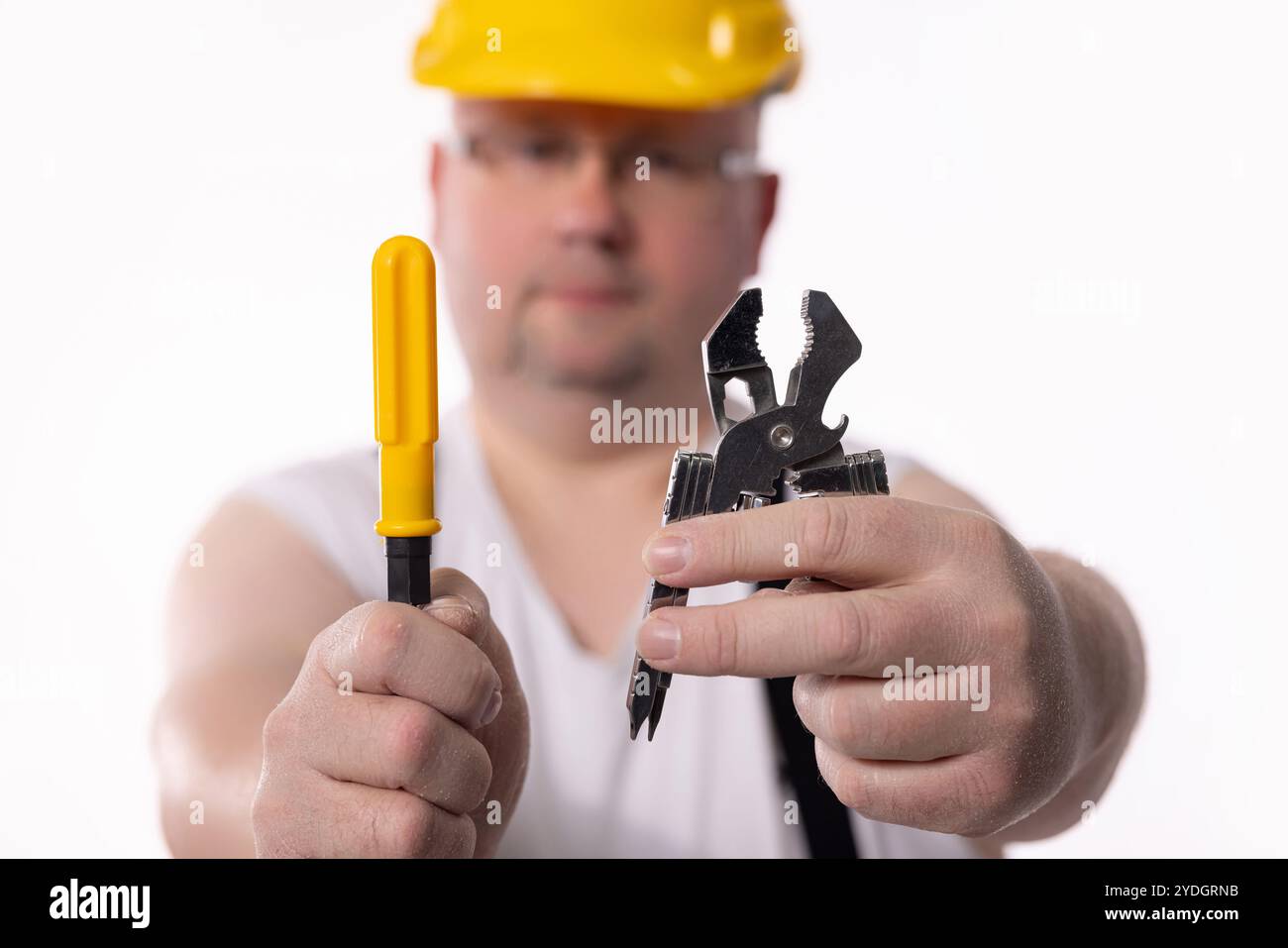 A construction worker grasping tools firmly in their hands, ready to ...