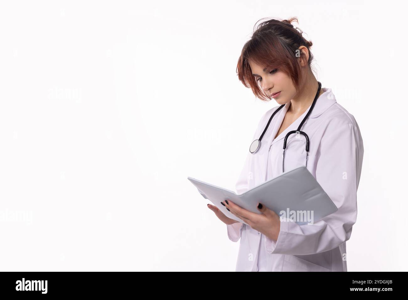A Medical Professional Engaging in the Thorough Review of Patient ...