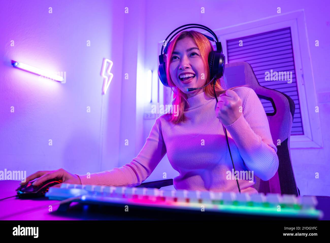 Happy excited competitive gamer playing hi-res stock photography and ...