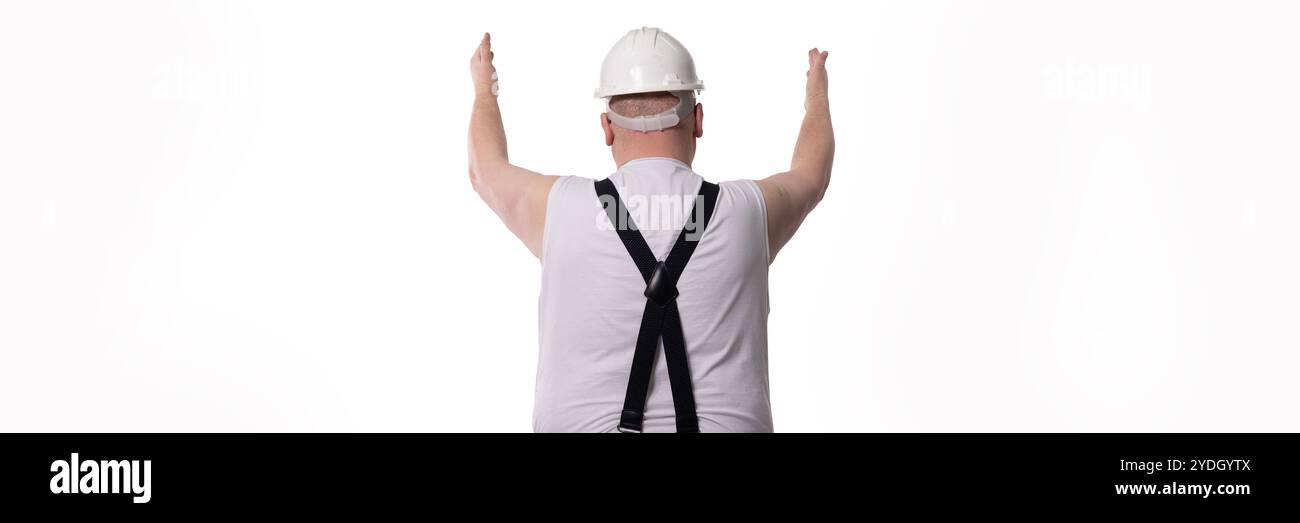A Construction Worker Exuberantly Raising His Hands While Wearing ...
