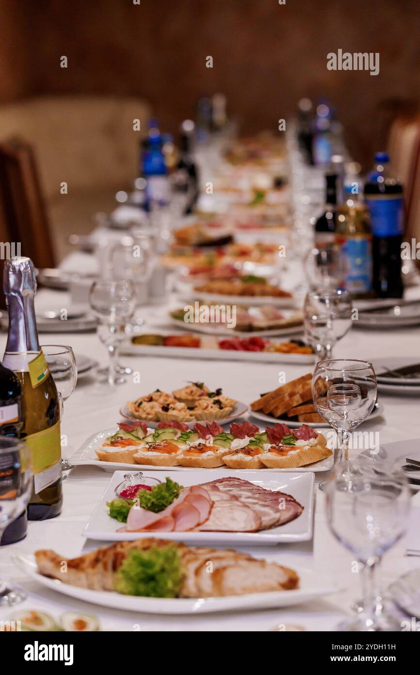 Elegant Banquet Table Set for a Culinary Feast Stock Photo - Alamy