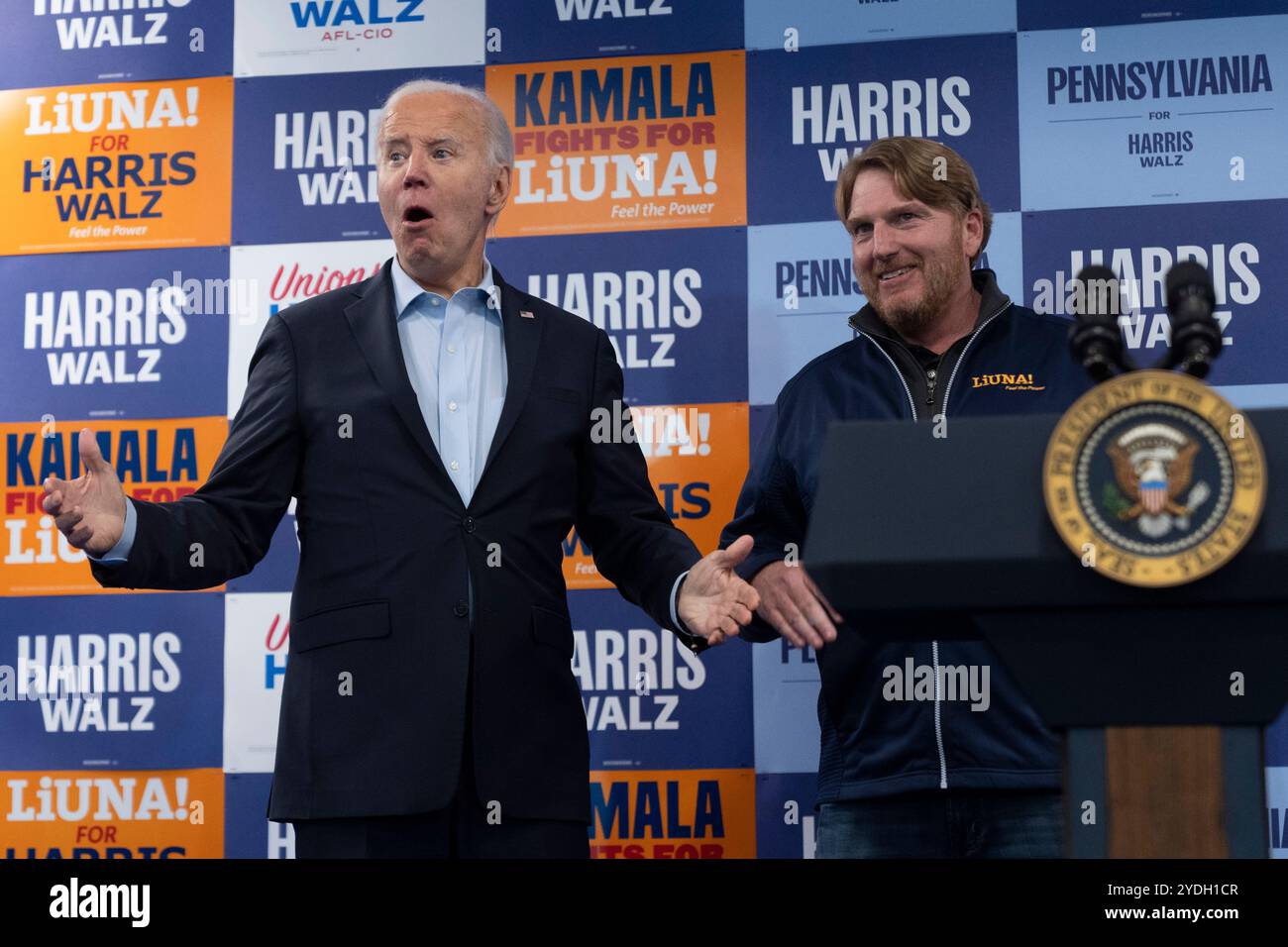 President Joe Biden, left, is greeted by Brent Booker, general ...