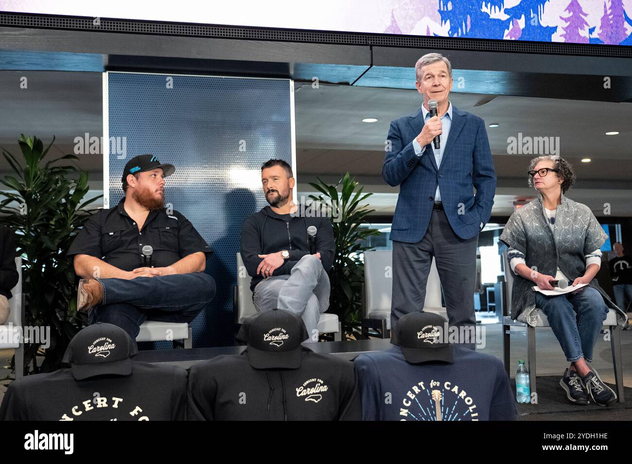 Luke Combs, from left, Eric Church, Governor Roy Cooper, and Vic Isley ...