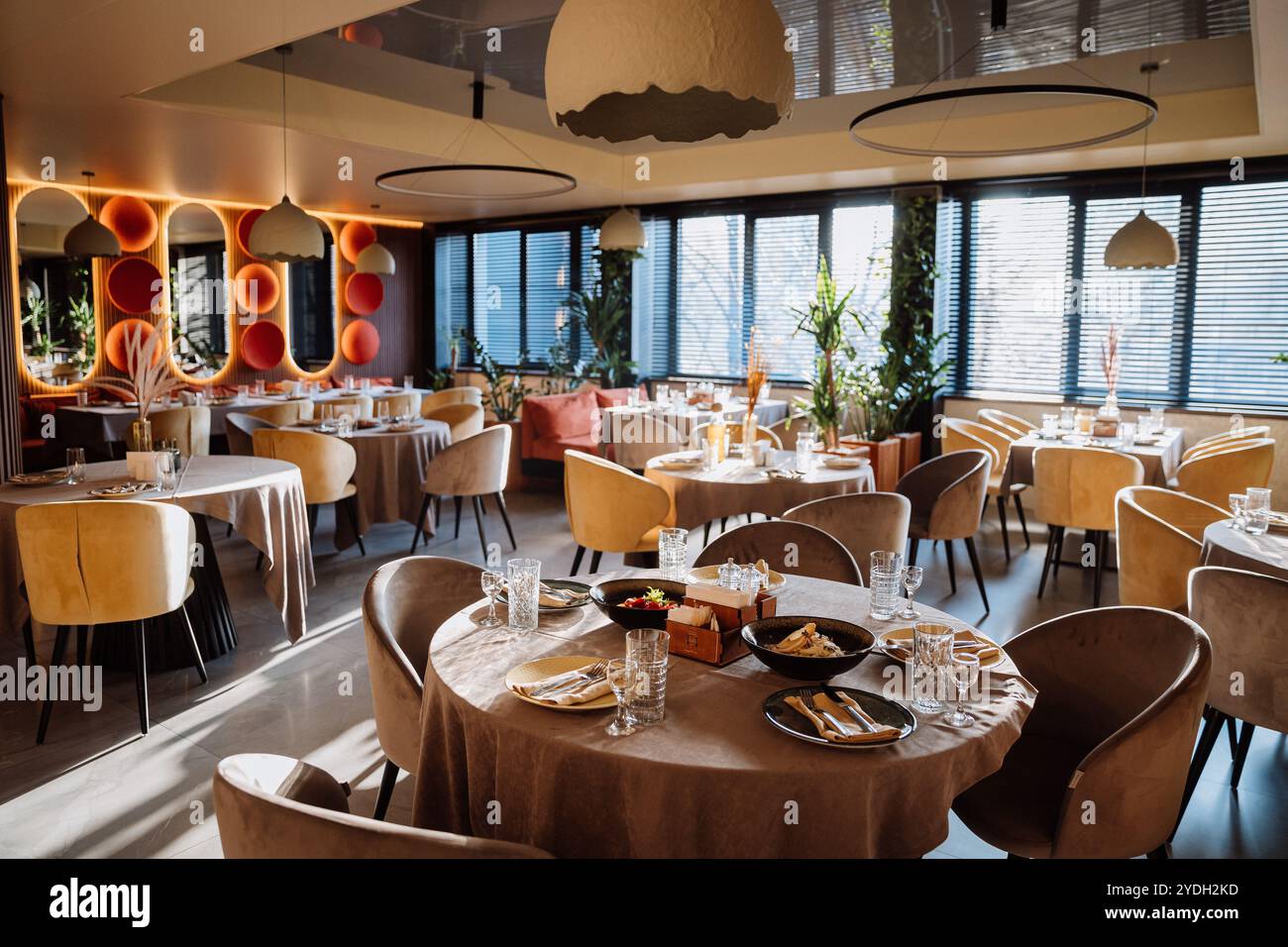 Modern restaurant interior with elegant decor, tables, and lighting ...
