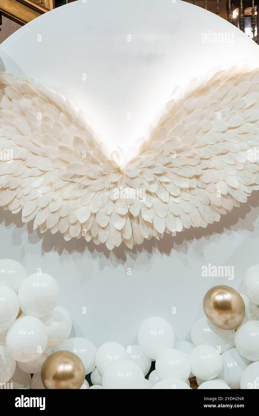 Elegant White Angel Wings Display Surrounded by Balloons Stock Photo ...