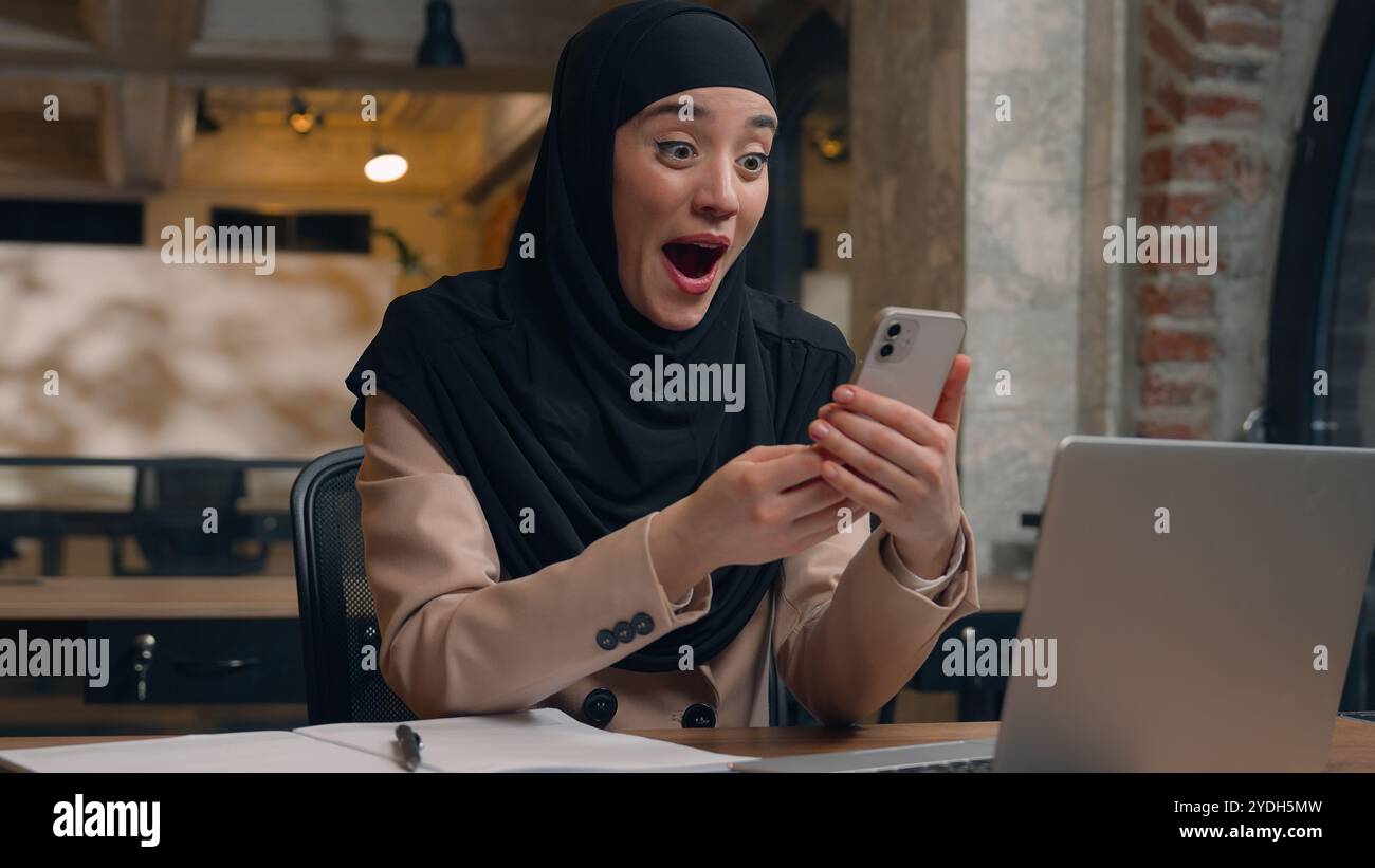 Happy excited joyful Arabian muslim business woman wonder amazement ...