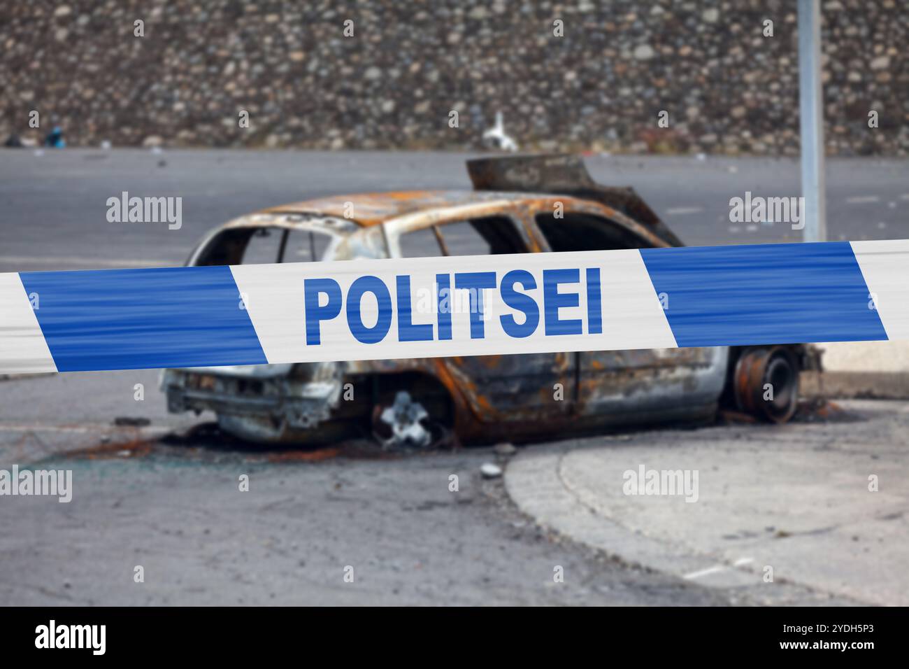 Car burnt by a pyromaniac with a police tape with written in it in ...