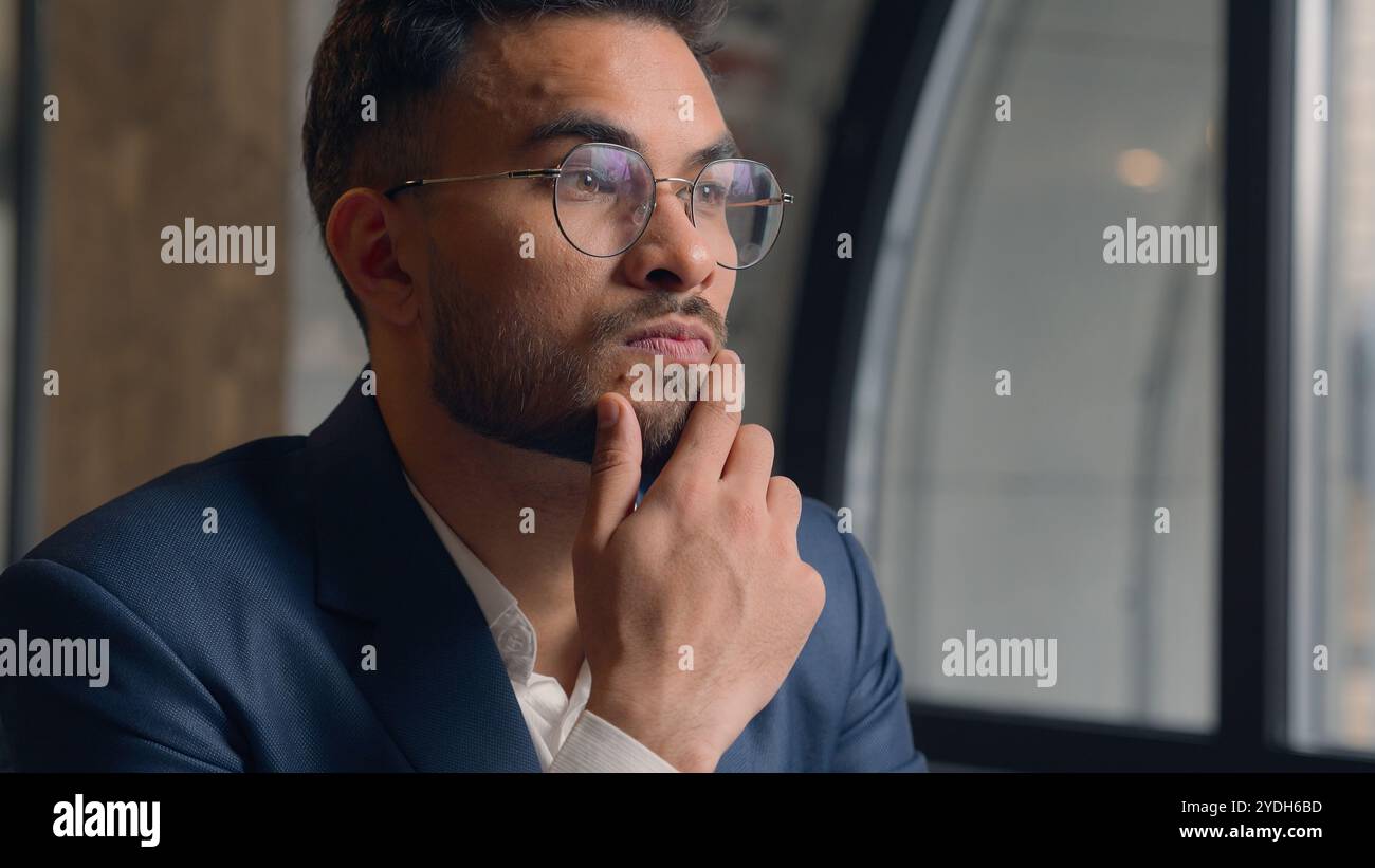 Thoughtful puzzled businessman Arabian Indian man thinking male guy ...