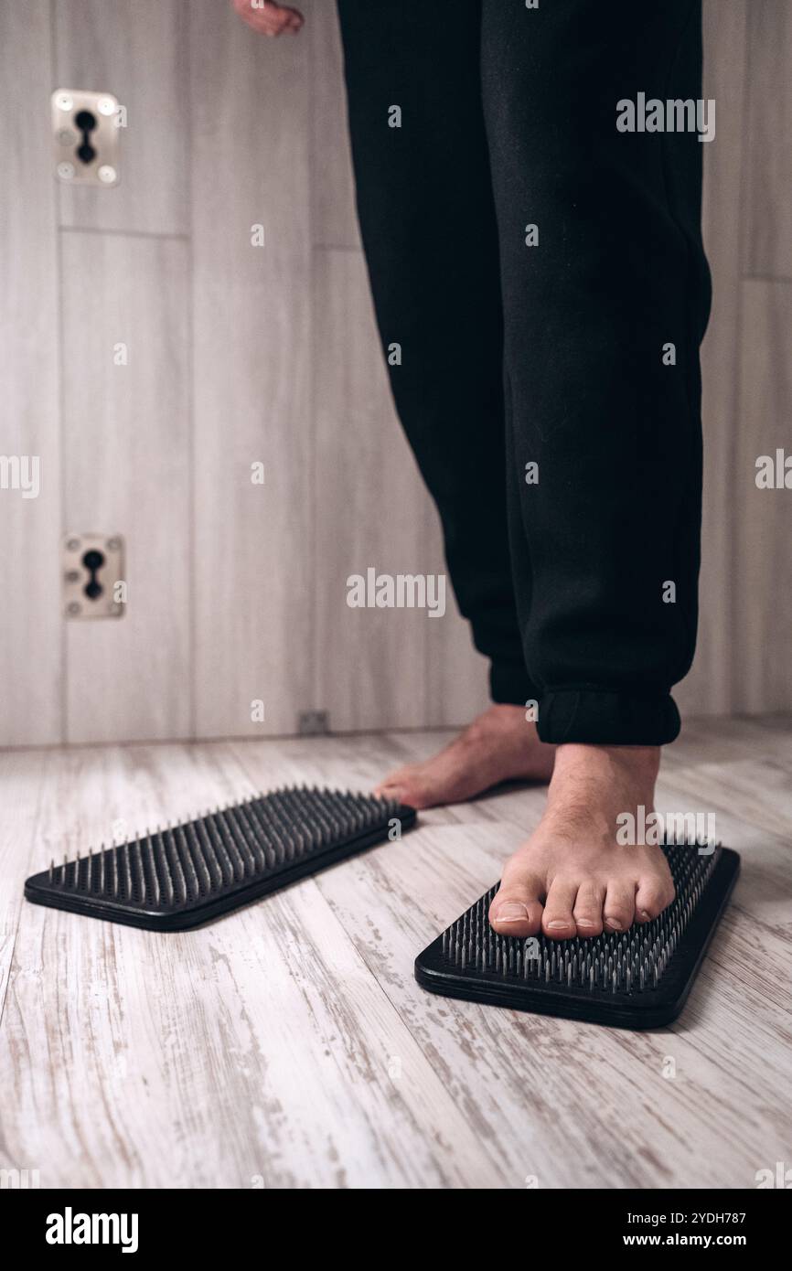 Foot acupressure therapy using standing Stock Photo - Alamy