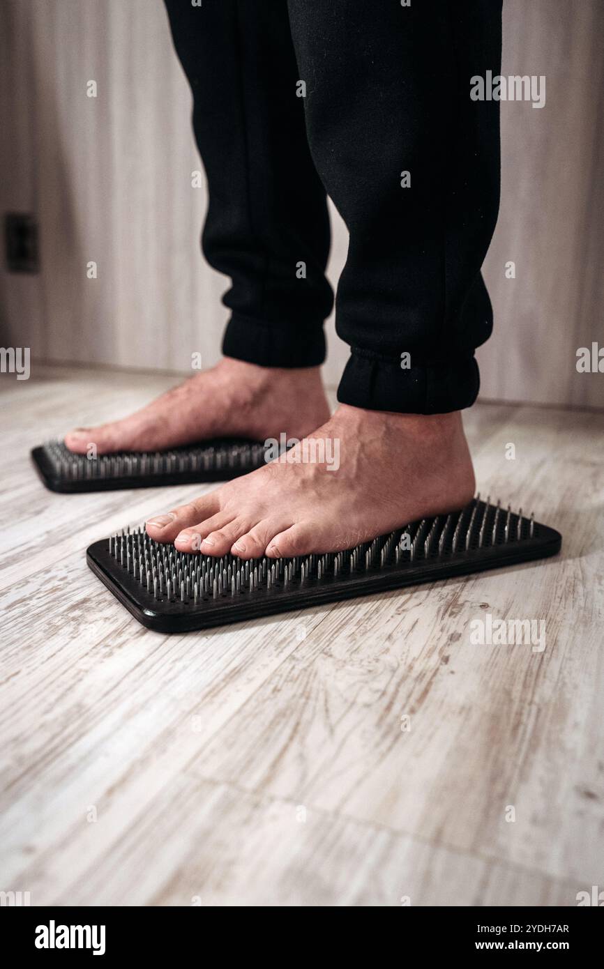 Foot acupressure therapy using standing Stock Photo - Alamy