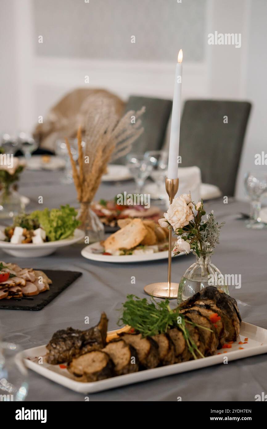 Elegant Dining Table Setting with Gourmet Dishes and Candlelight Stock ...