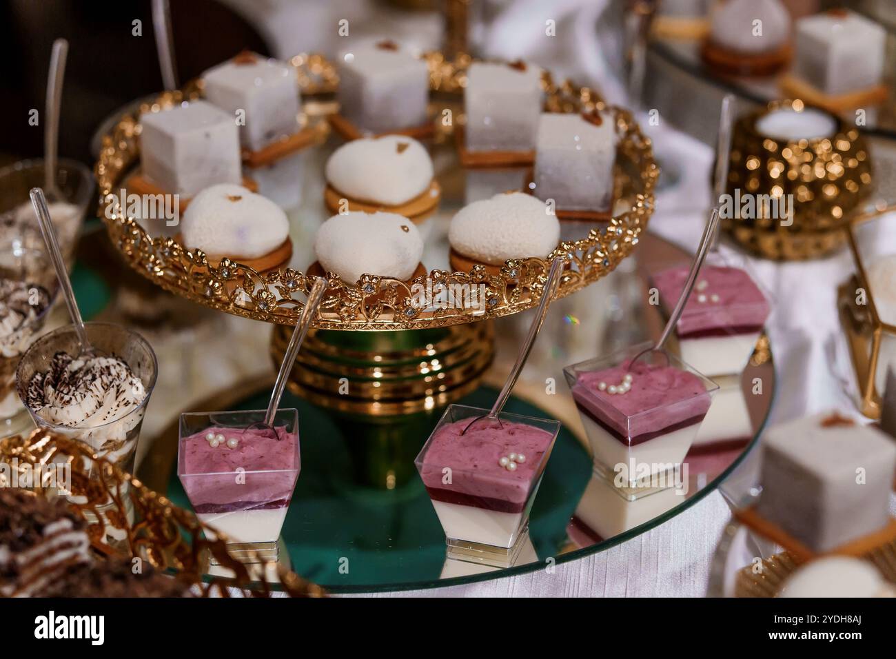 Elegant Dessert Display Featuring Assorted Miniature Pastries and Creamy Delights Stock Photo ...