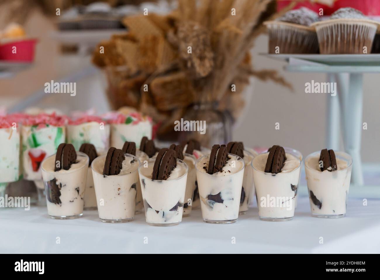 Delicious Dessert Display Featuring Mini Oreo Parfaits and Cupcakes ...