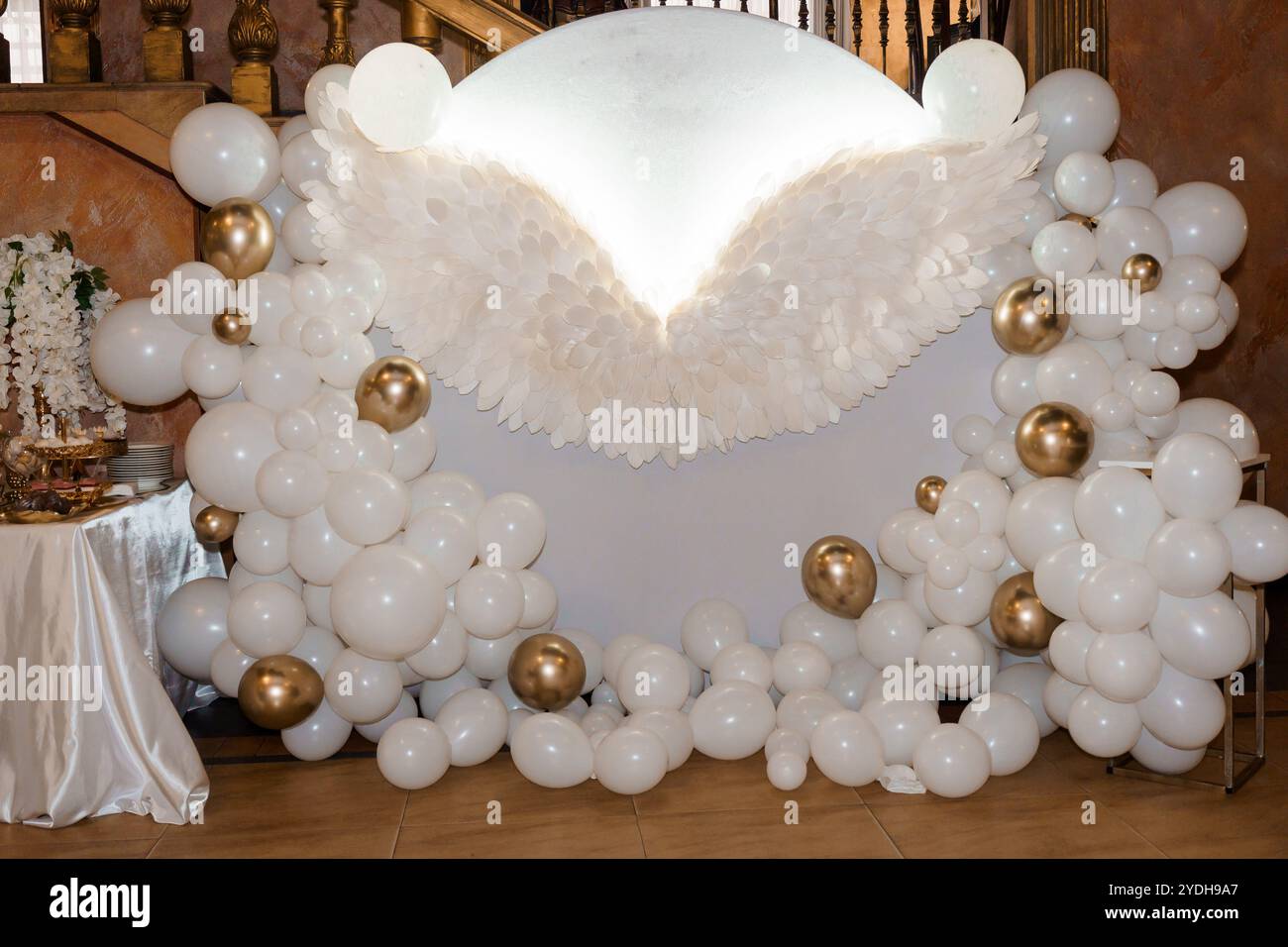 Elegant White Balloon Backdrop with Angel Wings for Celebratory Events ...