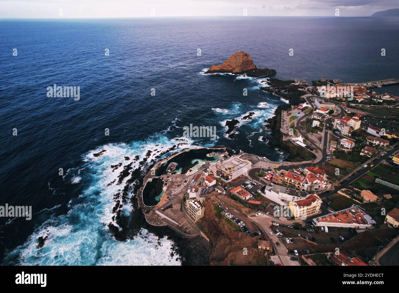 Aerial view of Porto Moniz with volcanic lava natural swimming pools ...