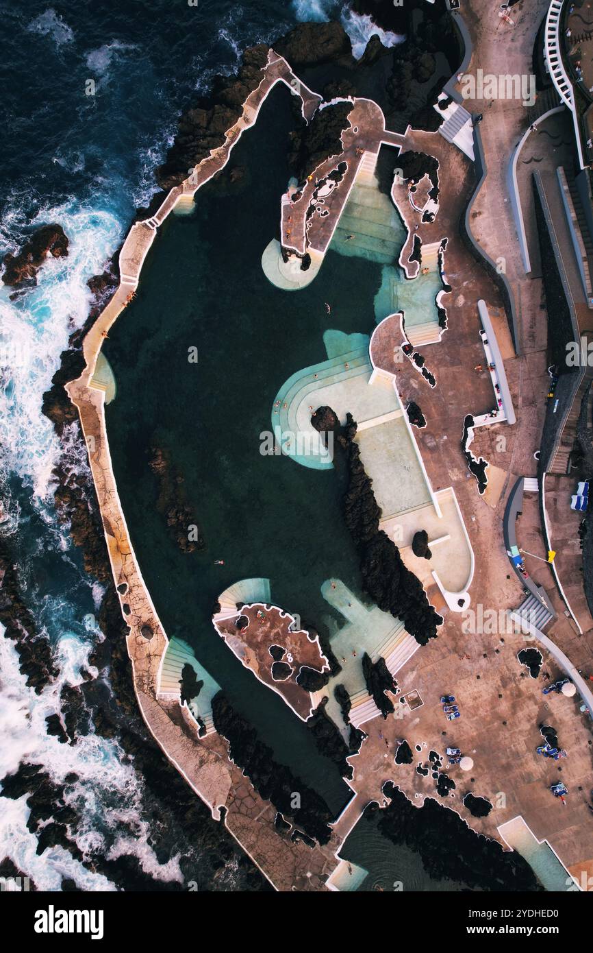 Aerial view of Porto Moniz with volcanic lava natural swimming pools ...