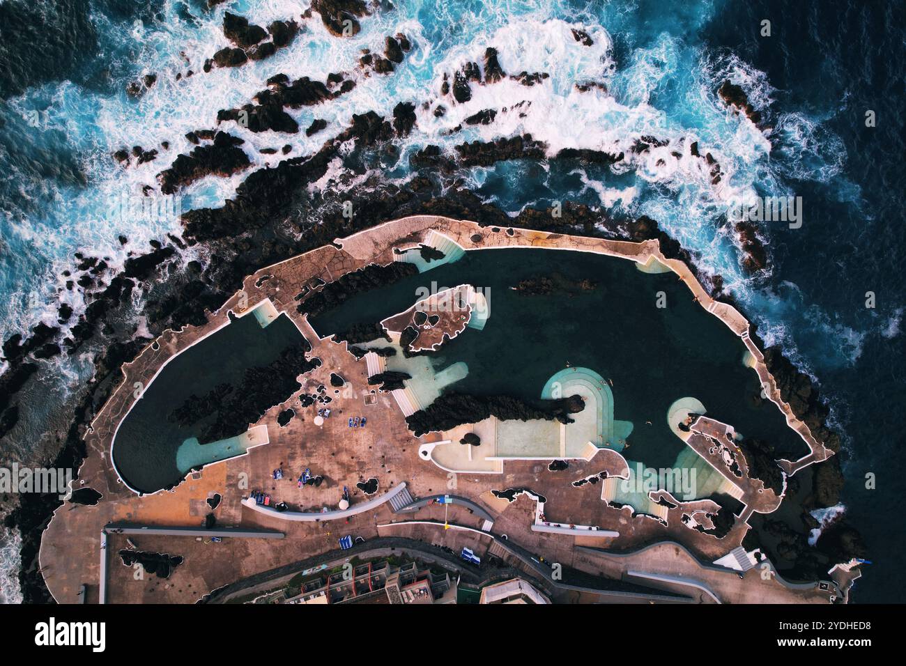 Aerial view of Porto Moniz with volcanic lava natural swimming pools ...