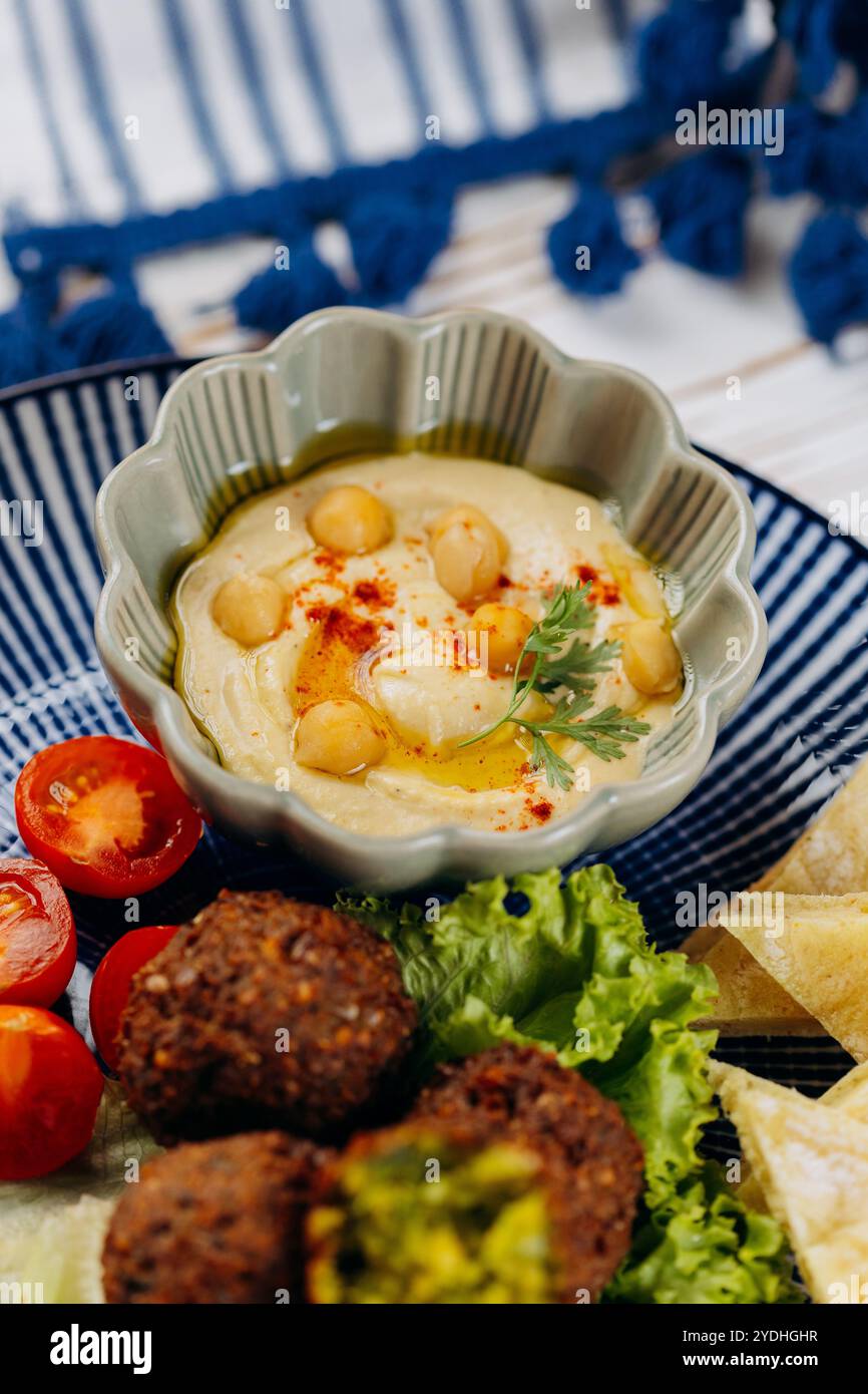 Creamy hummus topped with olive oil, chickpeas, and paprika. Perfect ...