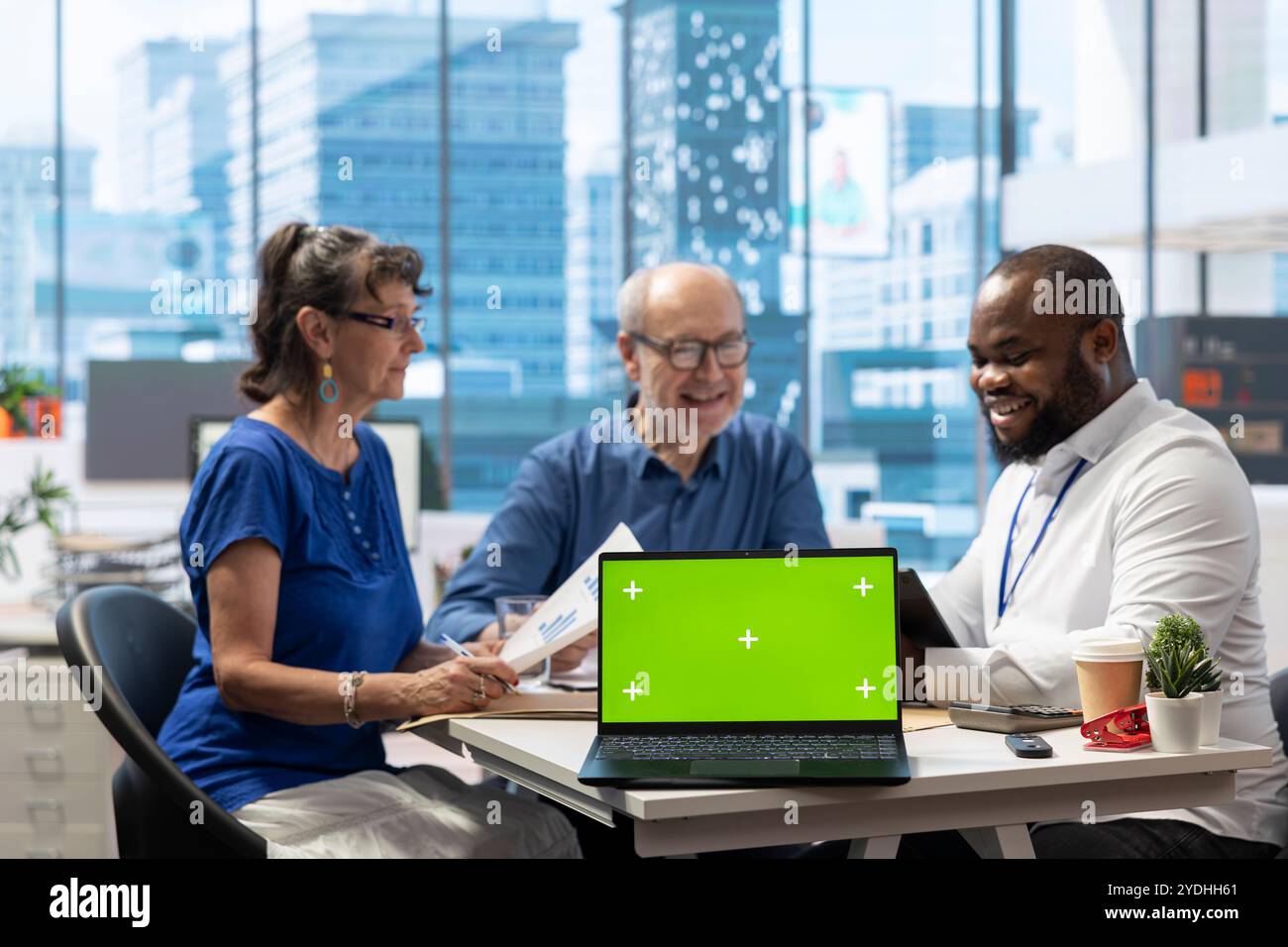 Banker guiding senior couple in choosing the right retirement plan ...