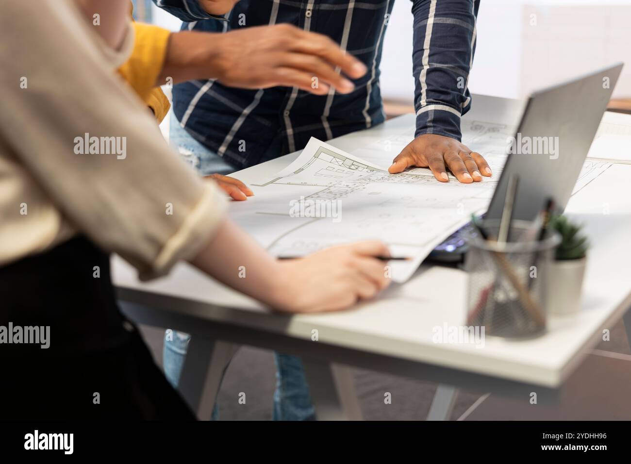 Business people engaging in office space layout planning with a ...