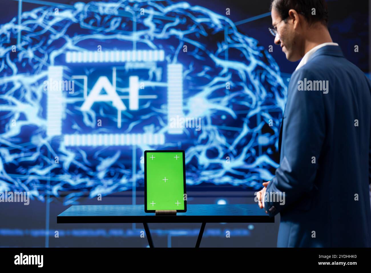 Computer scientist in startup doing advancements in AI field using chroma key tablet. Green ...