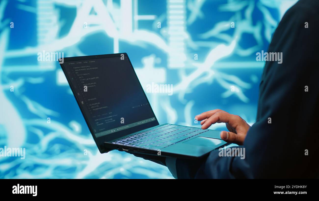 Technician uses laptop and AI neural networks modeled after human brain ... Technician uses laptop and AI neural networks modeled after human brain ...
