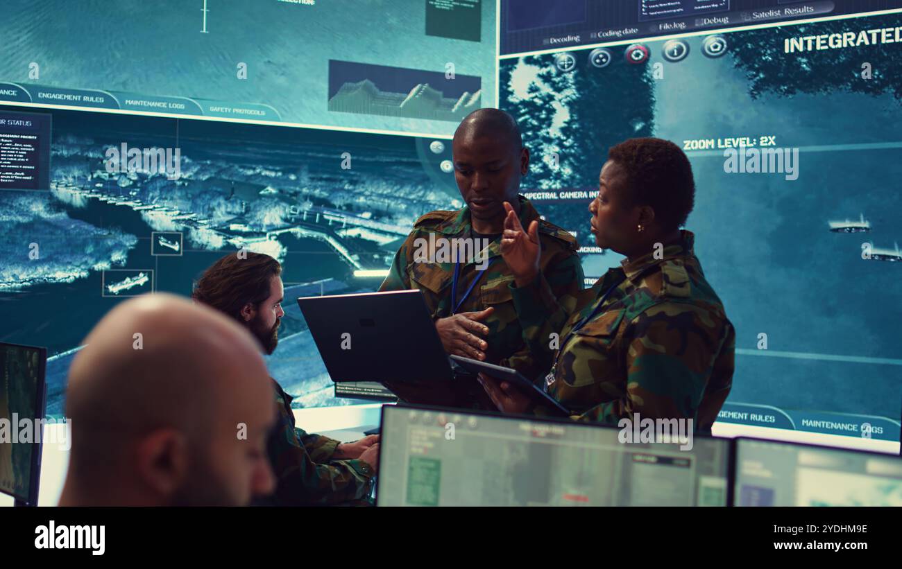 Special operations engineers examining surveillance footage to gather ...