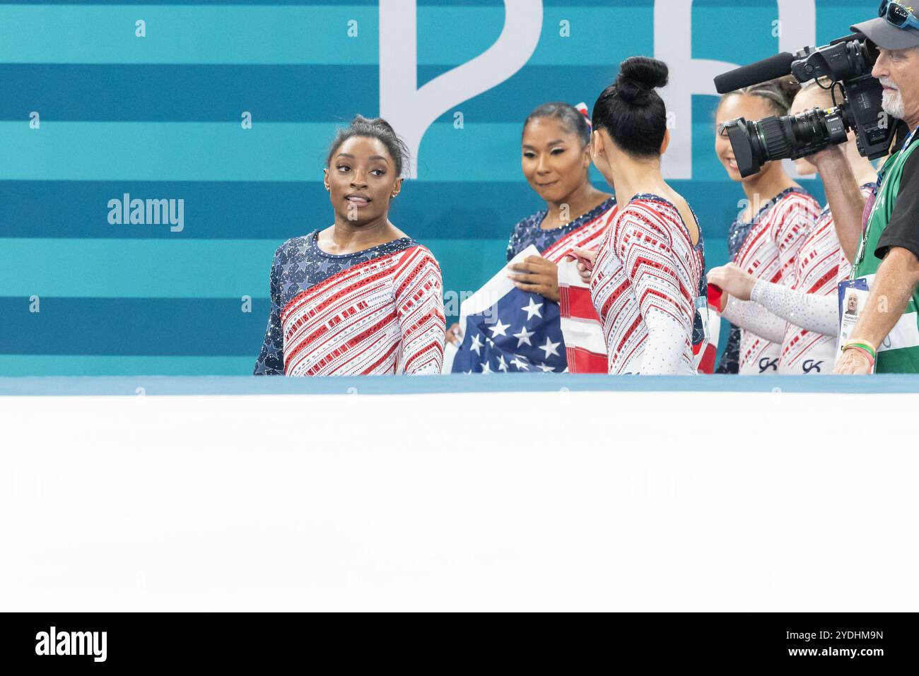 Paris, France. 30th July, 2024. Simone Biles and USA teammates await ...