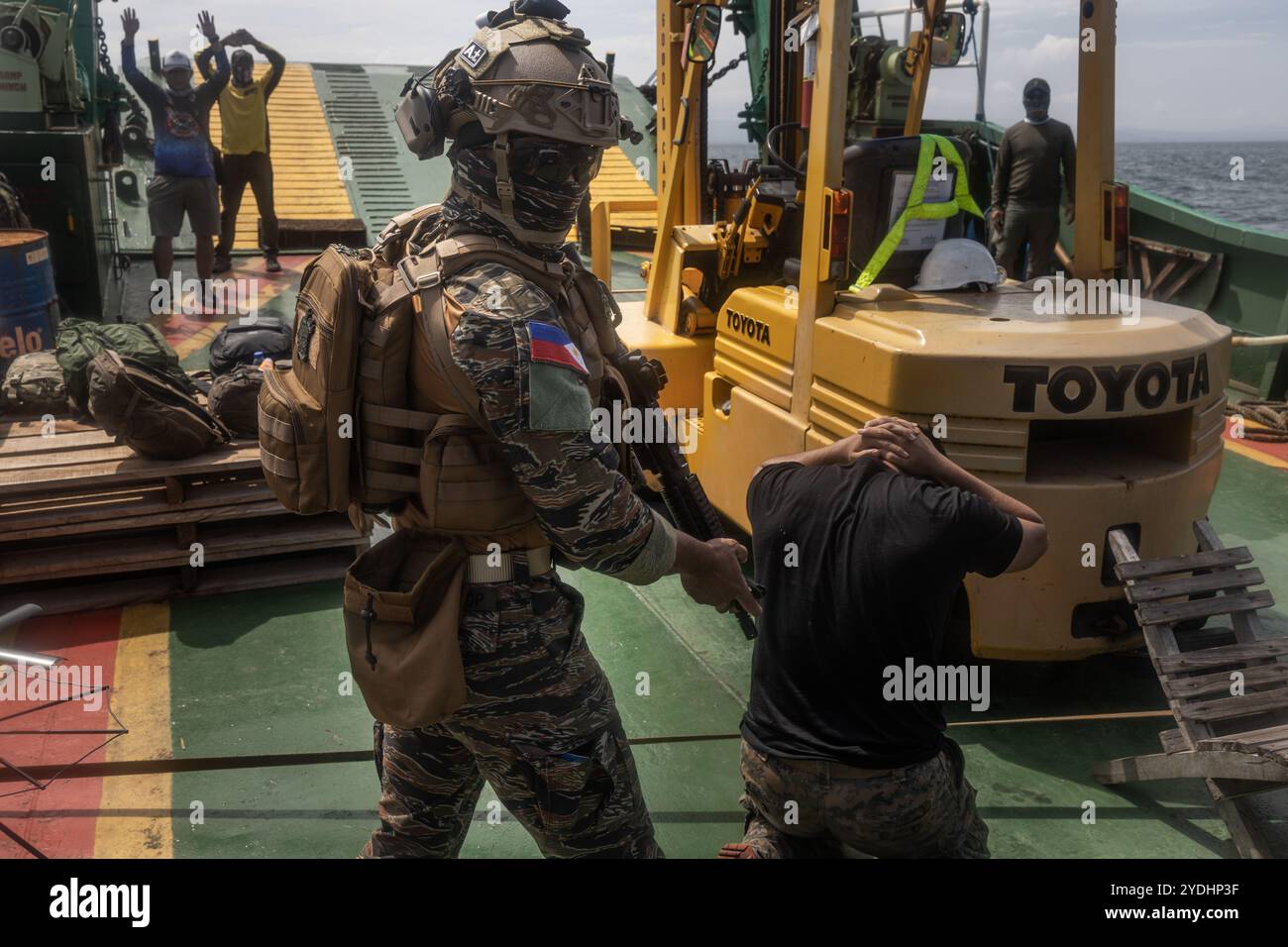 Armed Forces of the Philippines (AFP) service member detains an ...