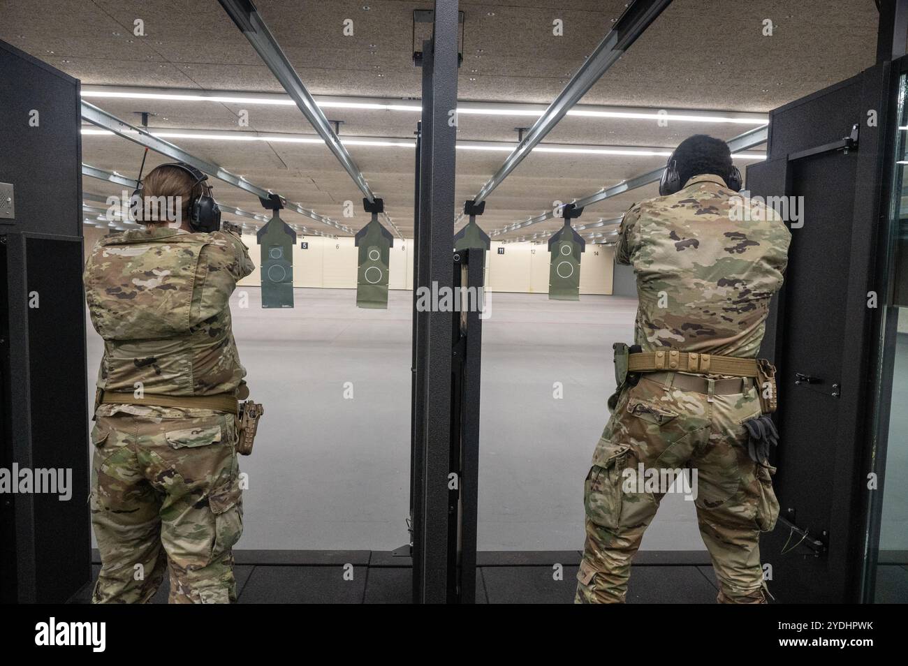 Airmen fire M18 handguns as part of small arms qualification at the new ...