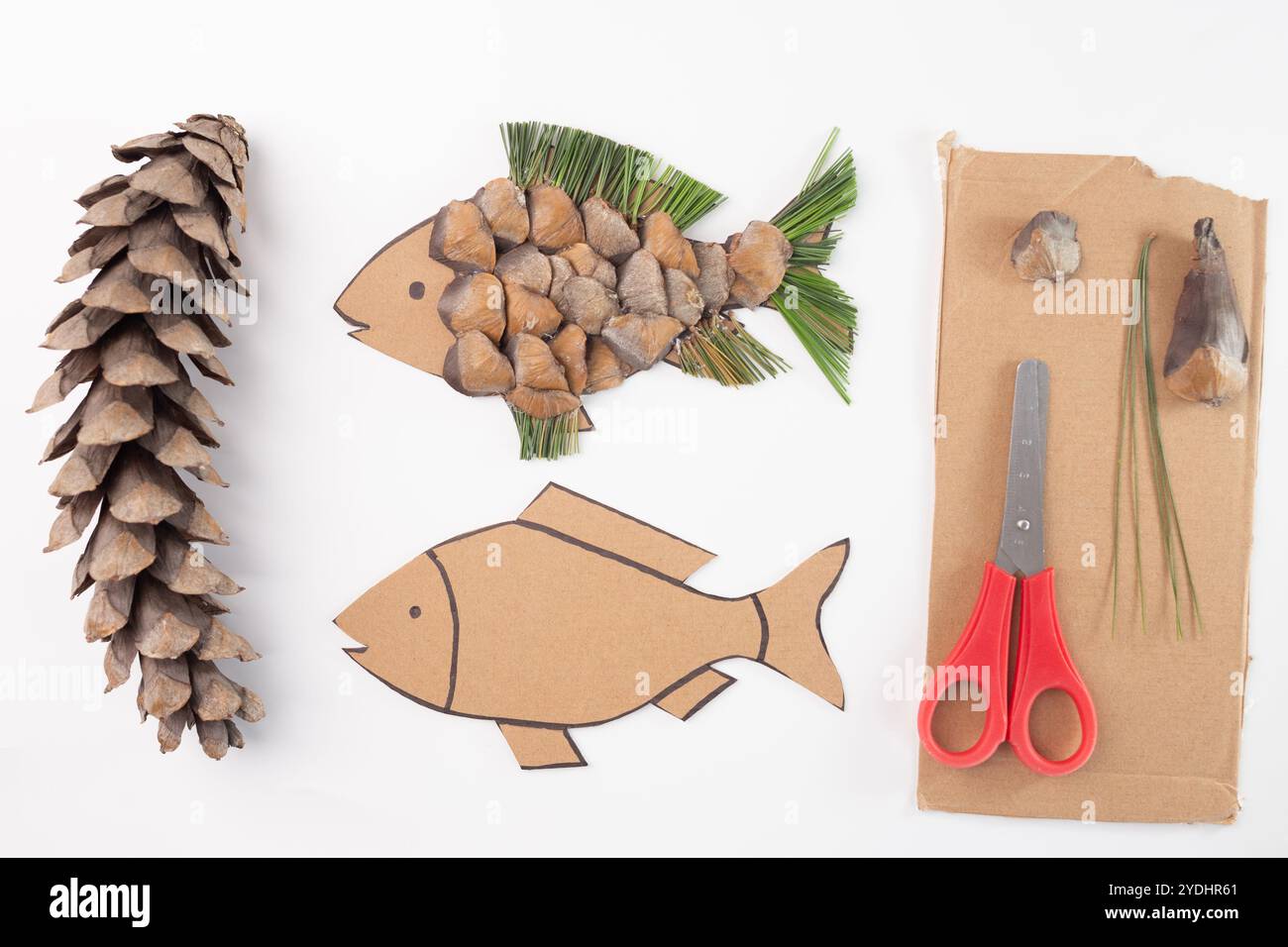 DIY fish craft using pinecone scales, pine needles, and cardboard with ...