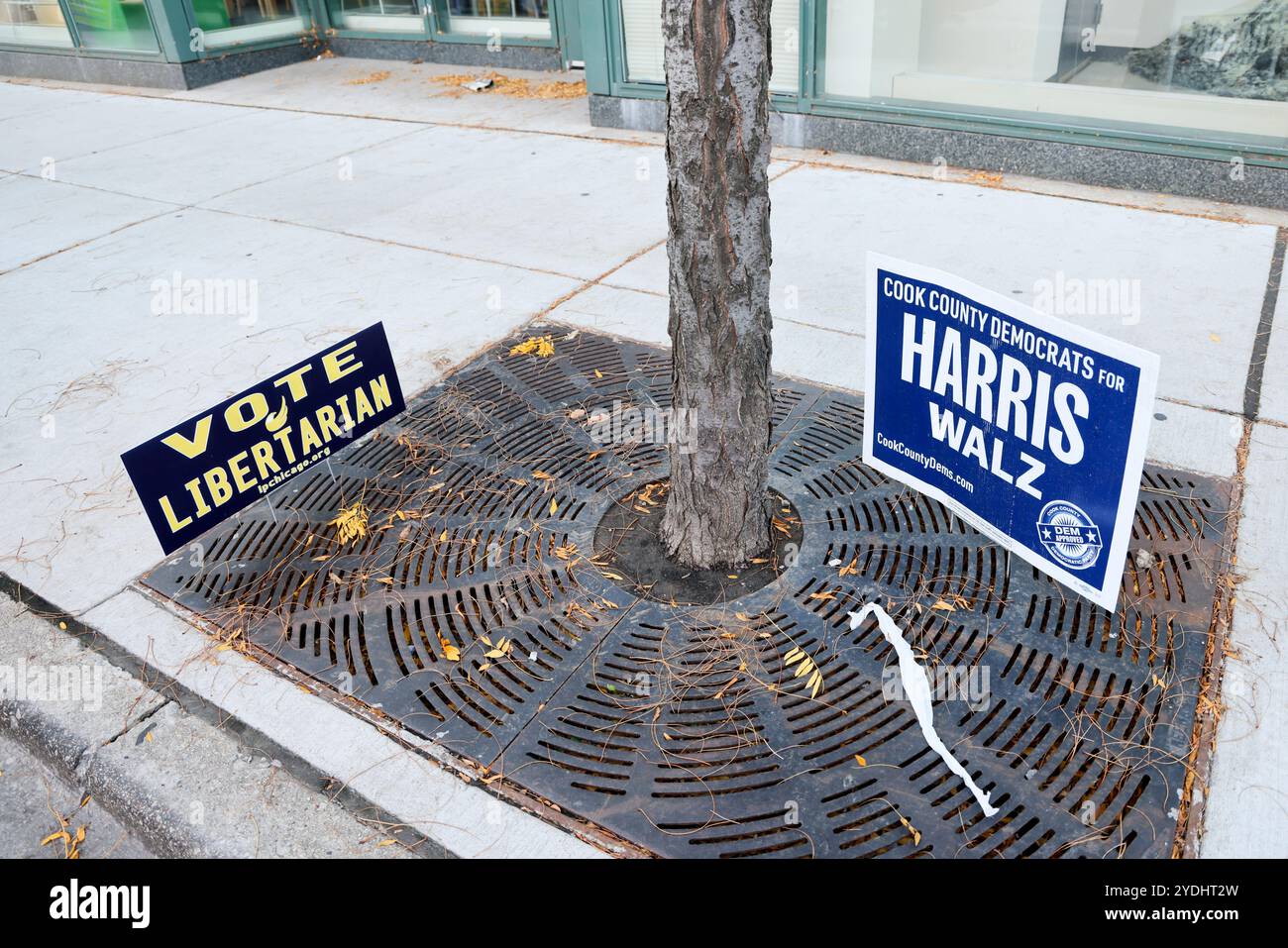 Placards for political candidates are placed outside of a polling place ...