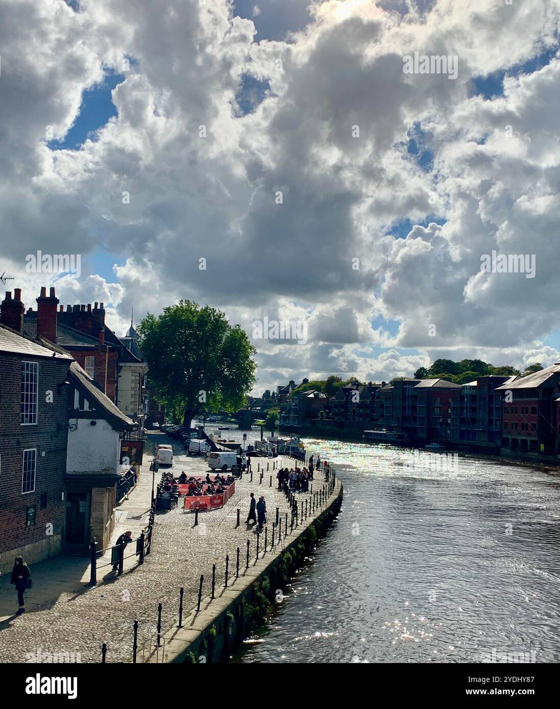 Tourists enjoy the late autumn sun on the pedestrianised walkway ...