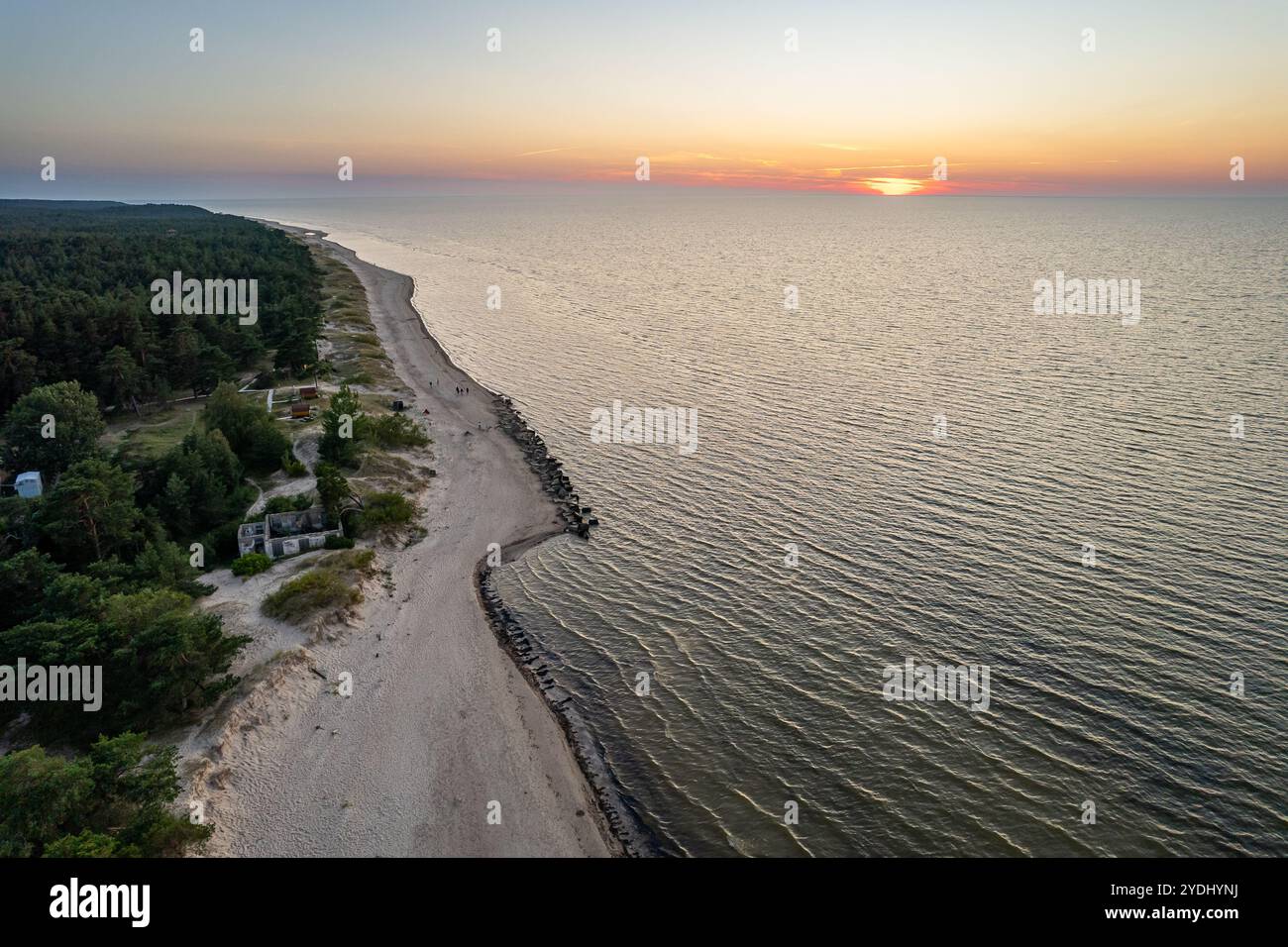 Aerial view of sunset above Cape Kolka and its surroundings in Latvia ...
