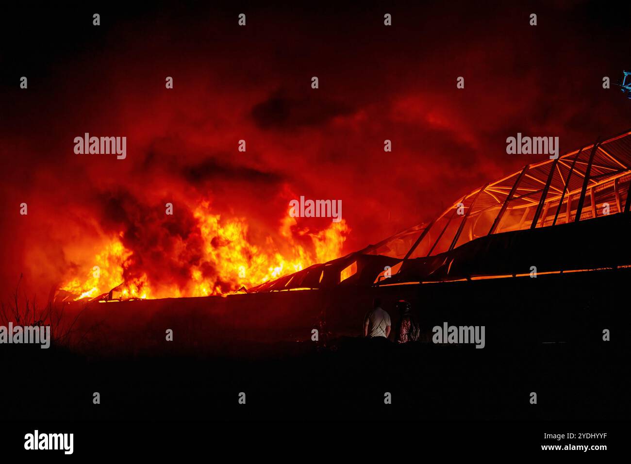 Burning industrial building. Big blaze and smoke at night Stock Photo ...