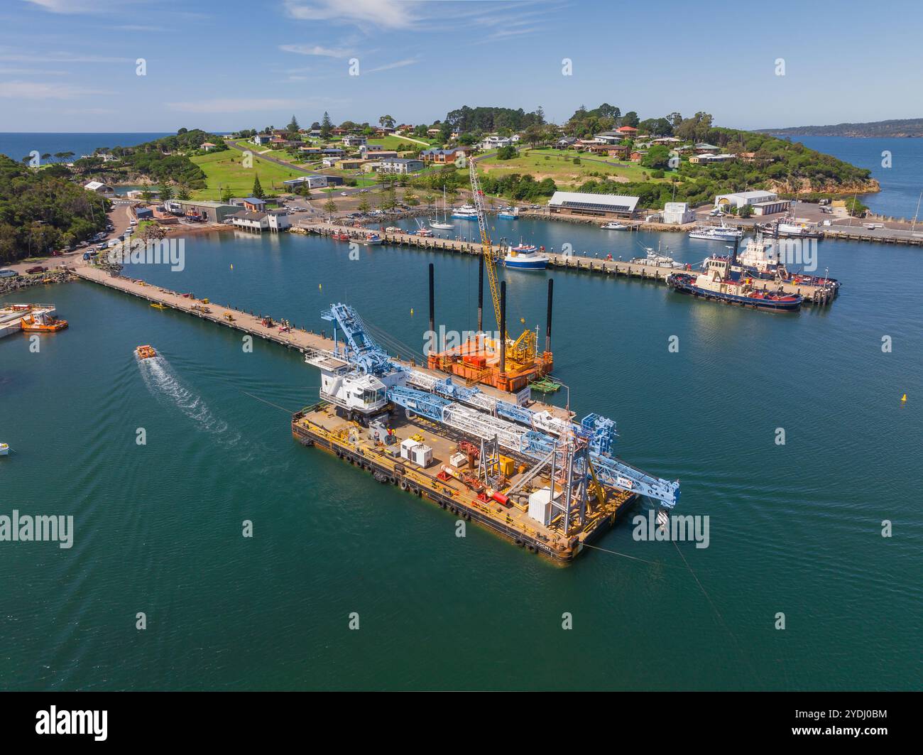 Aerial view of barges alongside a jetty at Eden on the South coast of ...