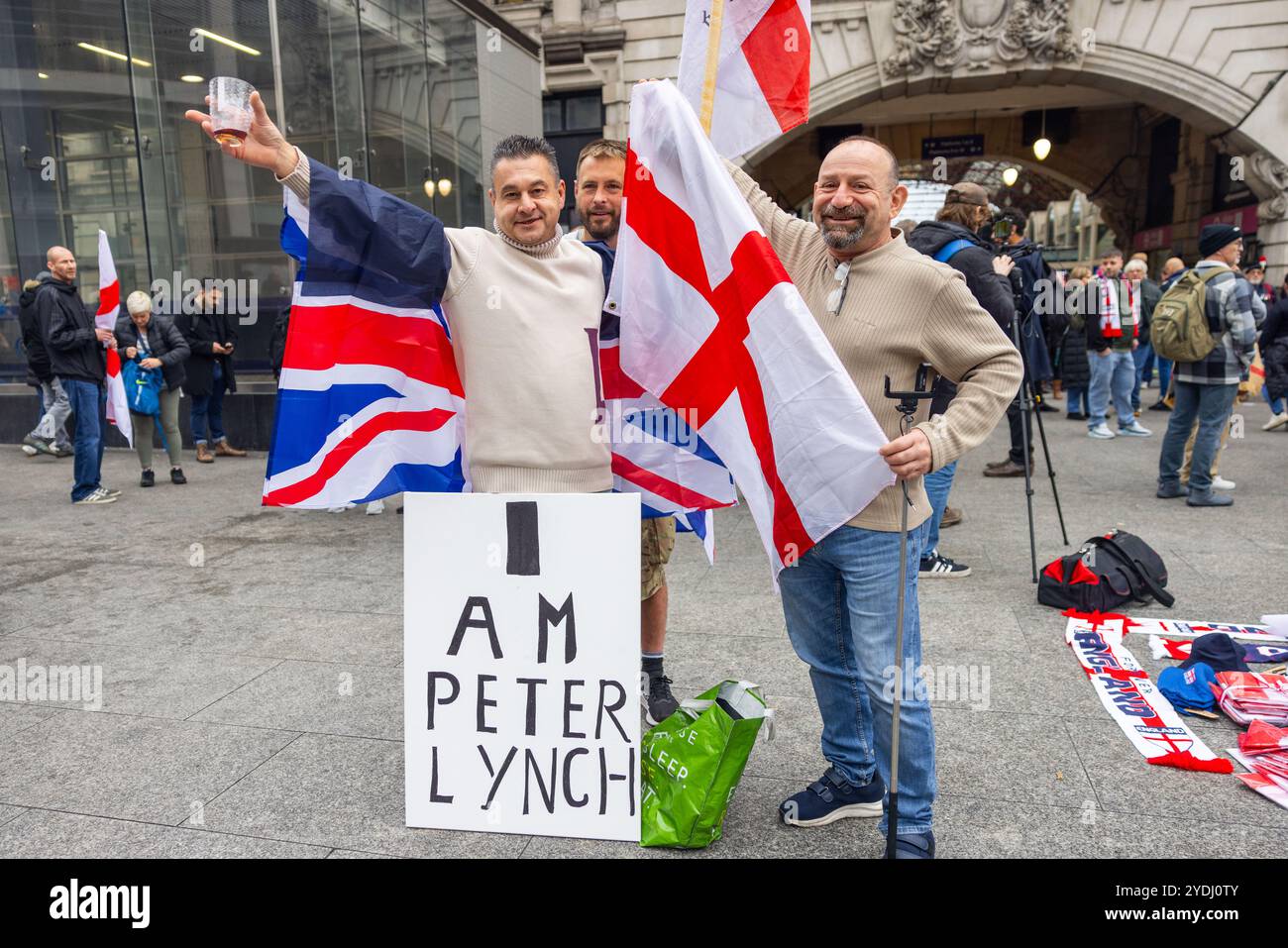 London, UK. 26 OCT, 2024. Men pose with sign commemorating Peter lynch ...