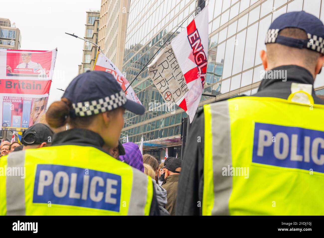London, UK. 26 OCT, 2024. Police next to Sign commemorating Peter lynch ...