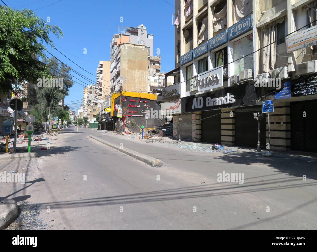 Deserted road after an Israeli strike in Haret Hreik, part of Dahiyeh ...