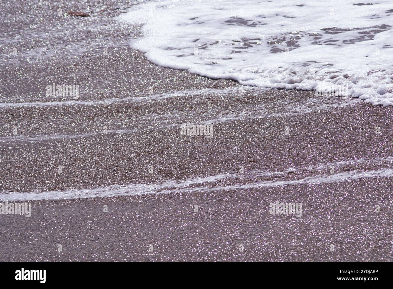 Seashore breaking water and sand Stock Photo - Alamy