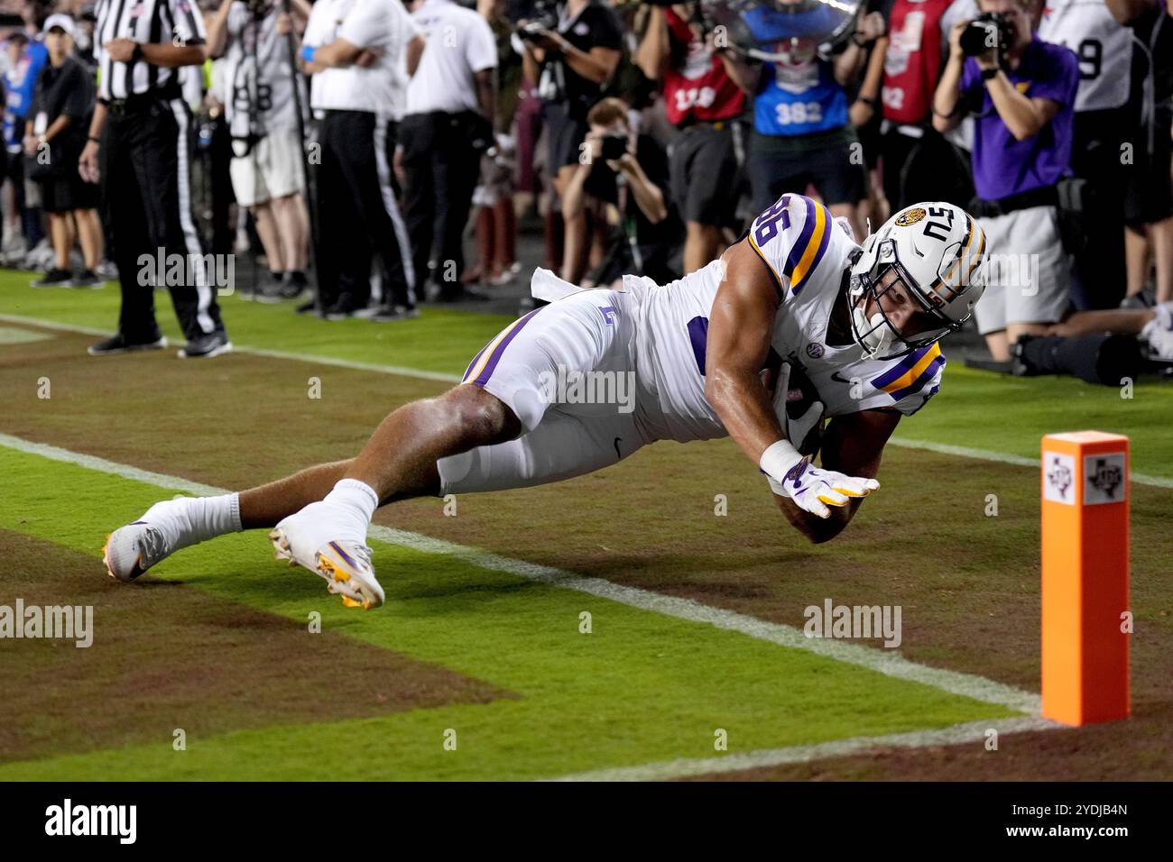 LSU tight end Mason Taylor (86) drags his feet after making a catch for ...